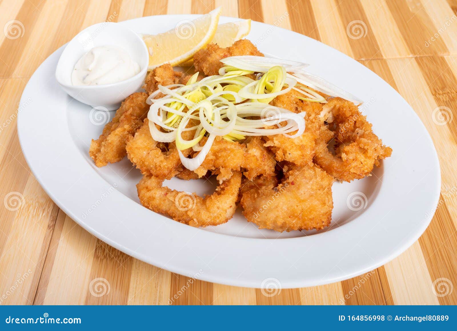 Grilled Squid Rings, with Lemon and Sauce Stock Photo - Image of ...