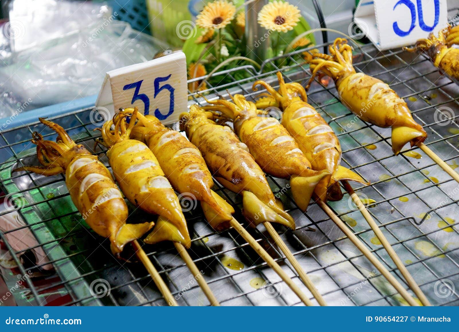 Grilled squid with stick stock image. Image of barbecue - 90654227
