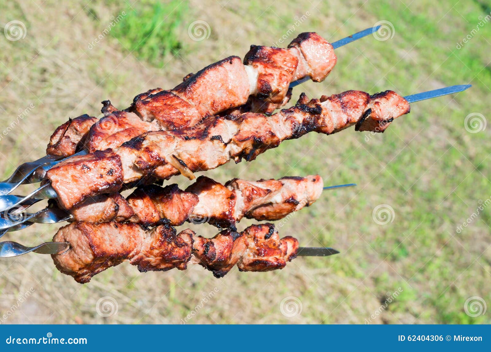 Grilling a Delicious Shashlik from Marinated Meat Stock Photo - Image ...
