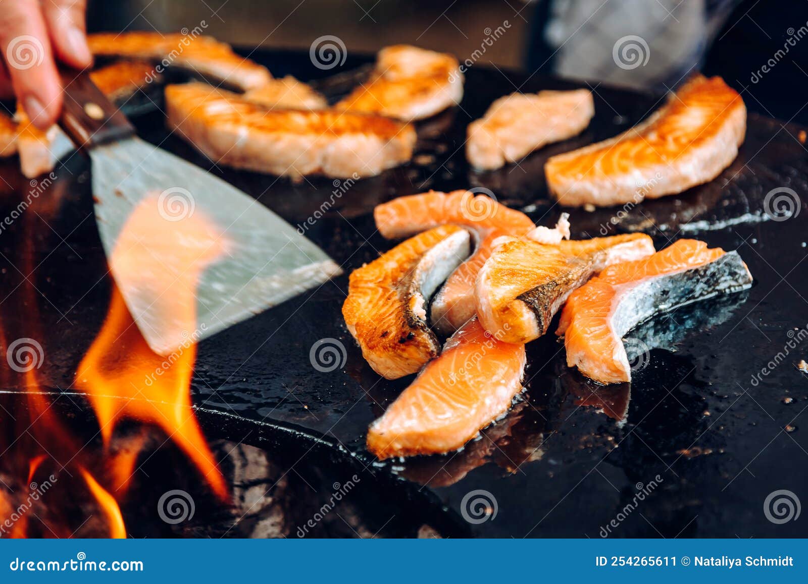 Grilling Fish on a Round Grill with an Open Fire. Stock Image - Image ...