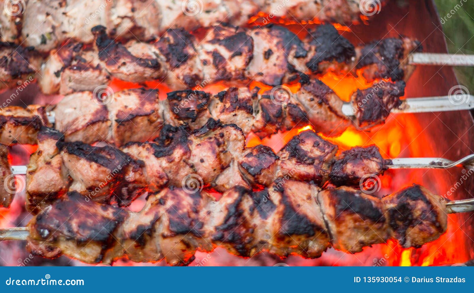 Grilling meat outdoors stock photo. Image of meat, preparation - 135930054