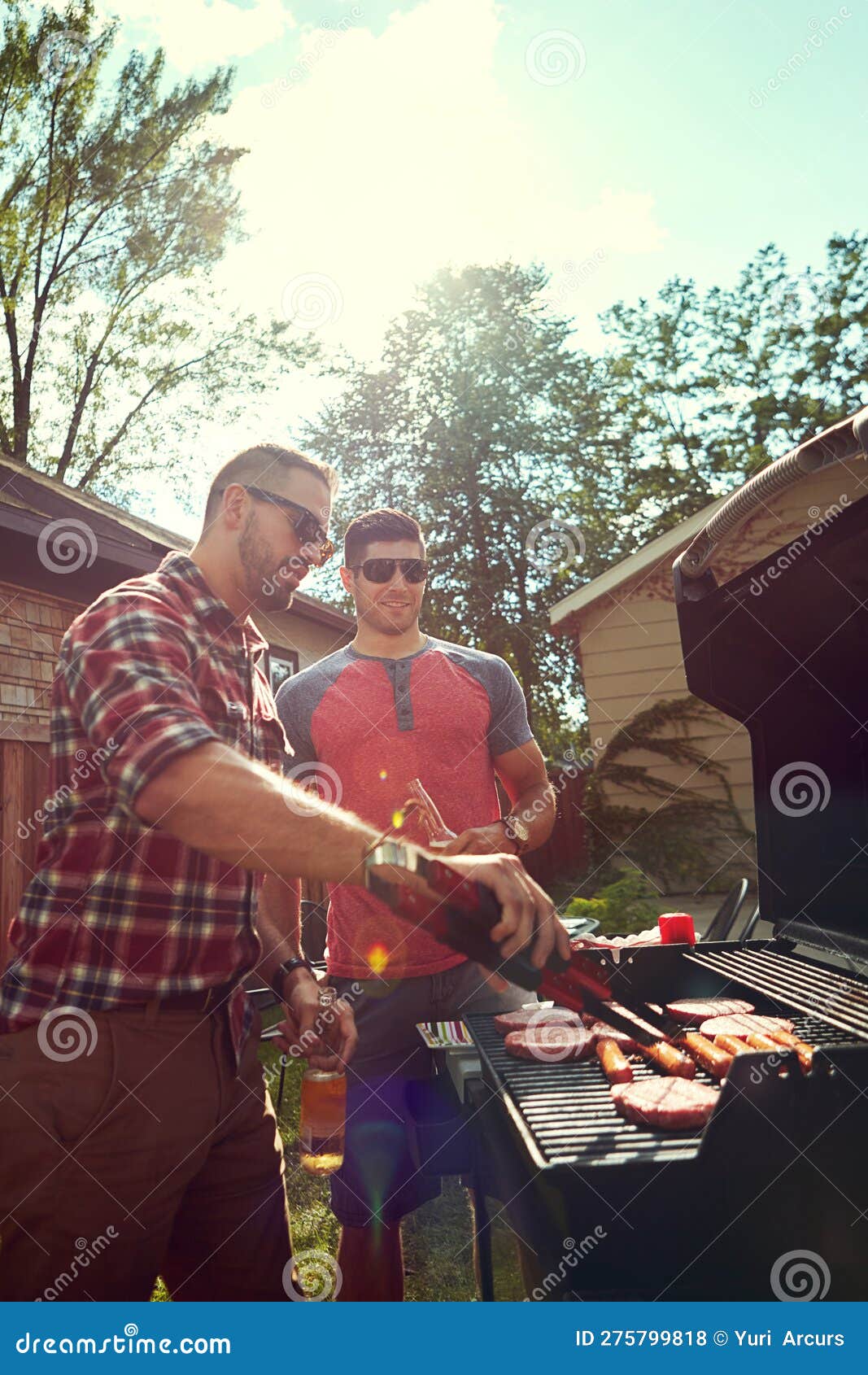 The Grillmaster is at it Again...friends Having a Barbecue Outside ...