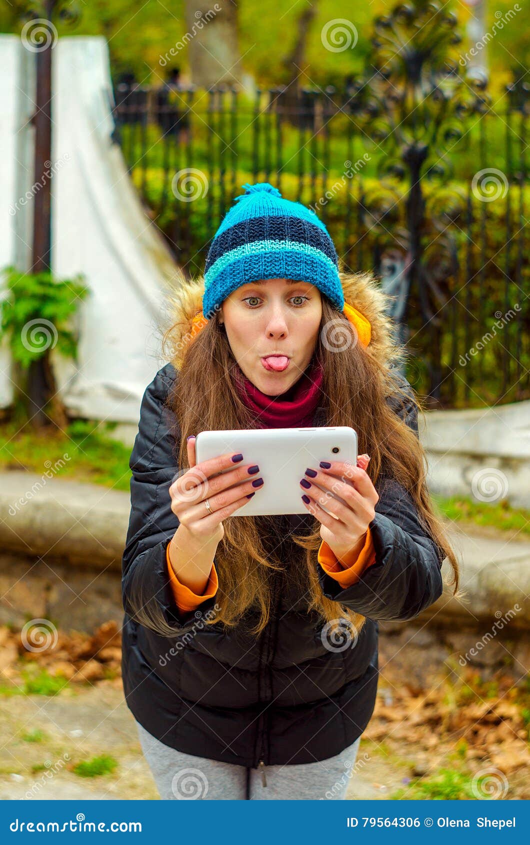 Grimacing at the camera stock photo. Image of gadget - 79564306