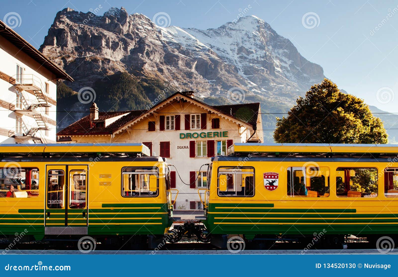 Grindelwald Train at Kleine Scheidegg Station with Tschuggen Peak ... Grindelwald Train at Kleine Scheidegg Station with Tschuggen Peak ...