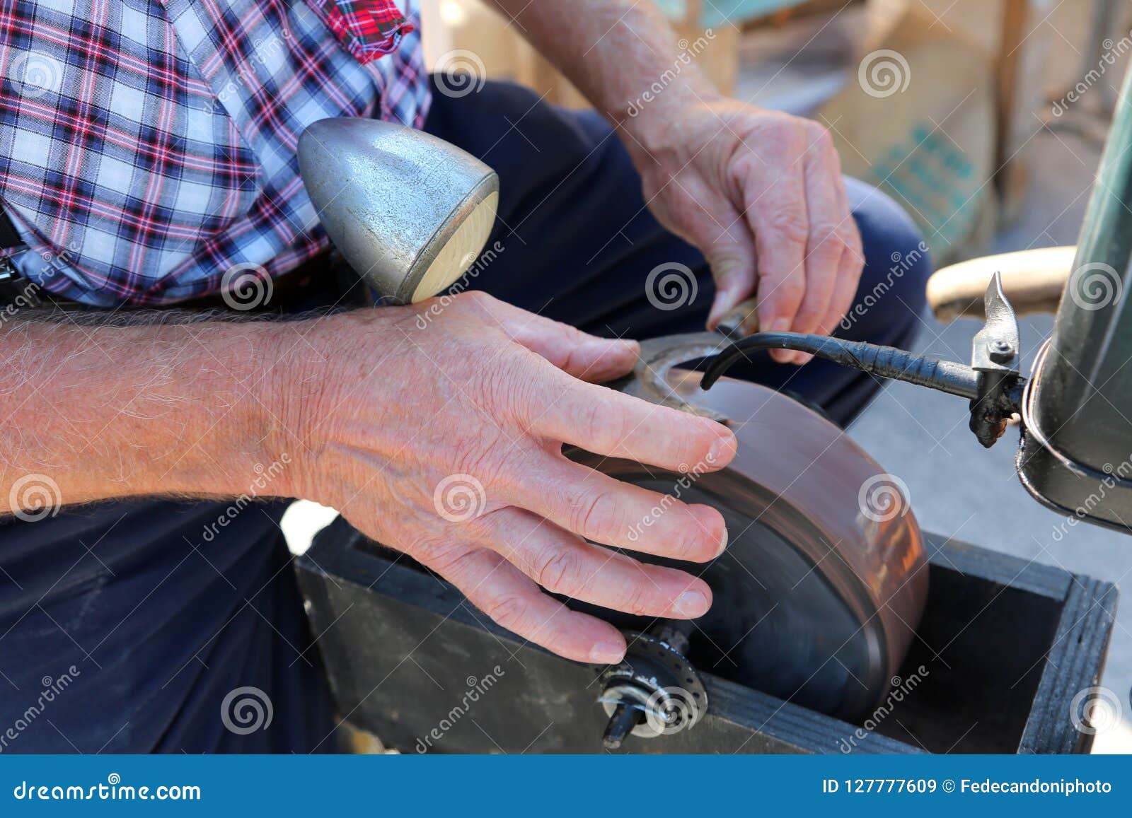 Grinder with Grindstone Grinding the Blade of Billhook Stock Image ...