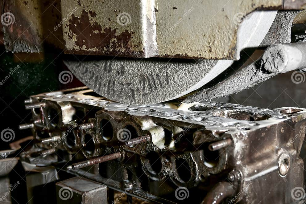 Grinding the Cylinder Head of a Car Engine on a Water-cooled Surface ...