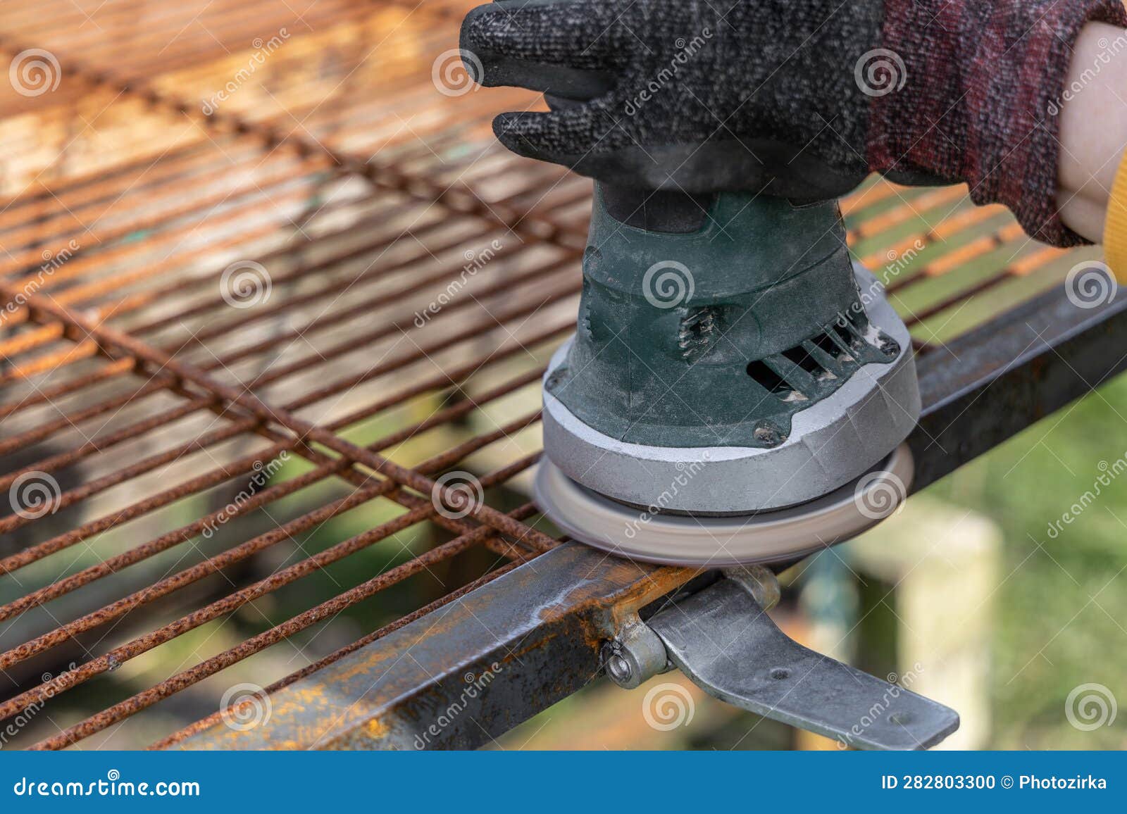 Grinding of a Metal Grid Using a Vibrating Sander Stock Photo - Image ...