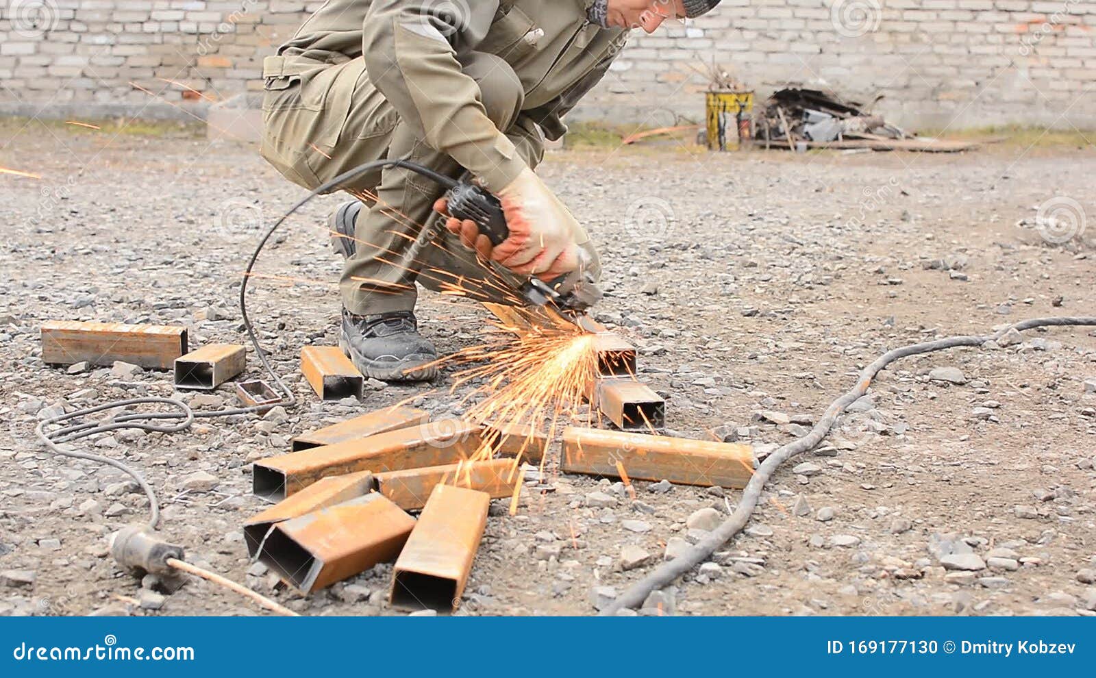Grinding Metal Using a Hand-held Machine with a Cutting Disc. Stock ...