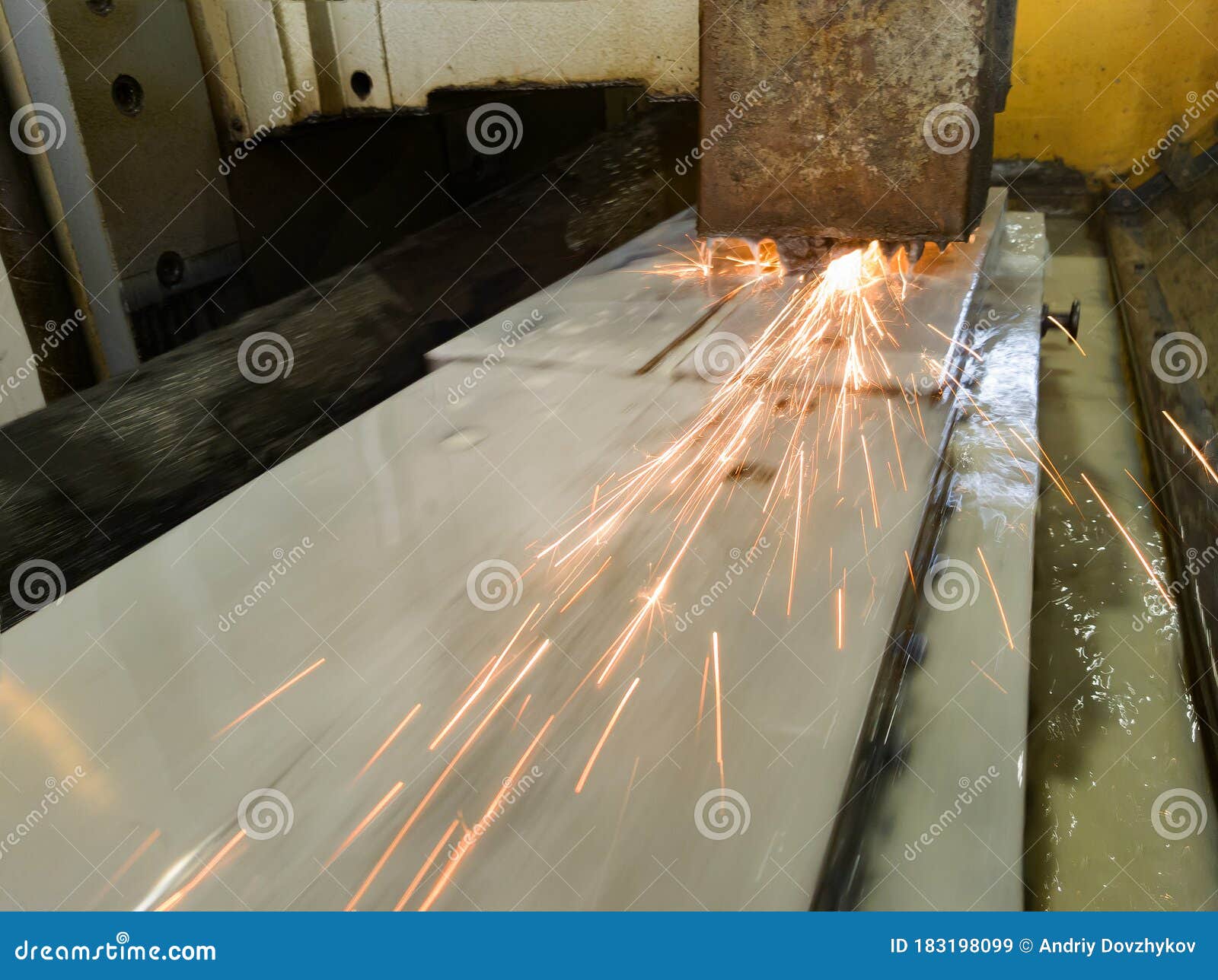 Grinding the Plate on a Surface Grinding Machine. Sparks and Water ...