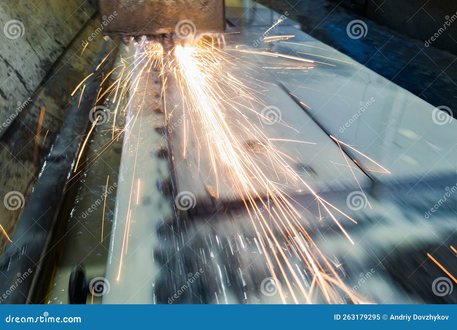 Grinding the Plate on a Surface Grinding Machine. Sparks and Water ...