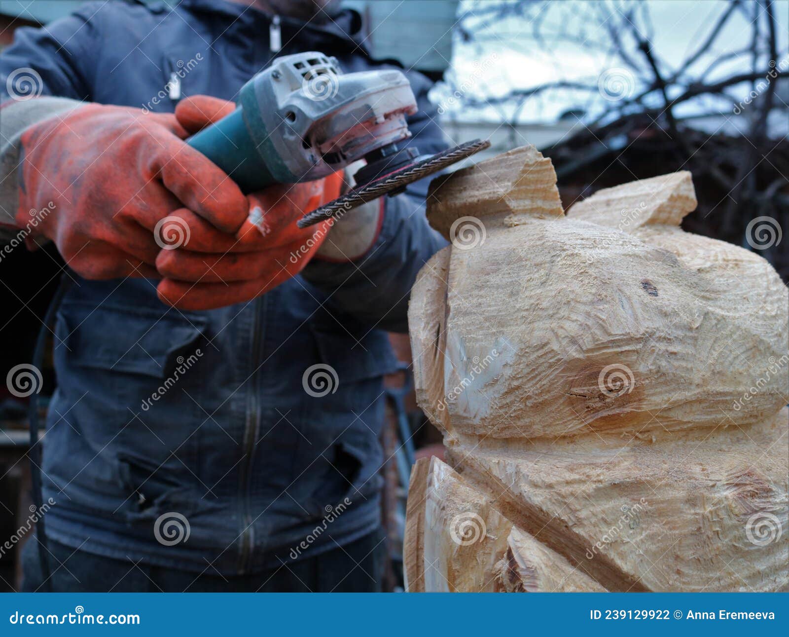Grinding a Wooden Object with a Hand-held Electric Tool Stock Photo ...