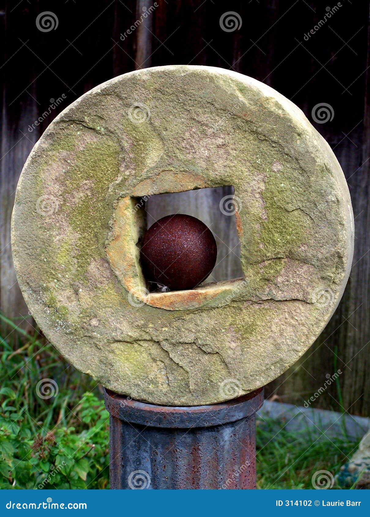 Grindstone with cannonball stock photo. Image of pedestal - 314102