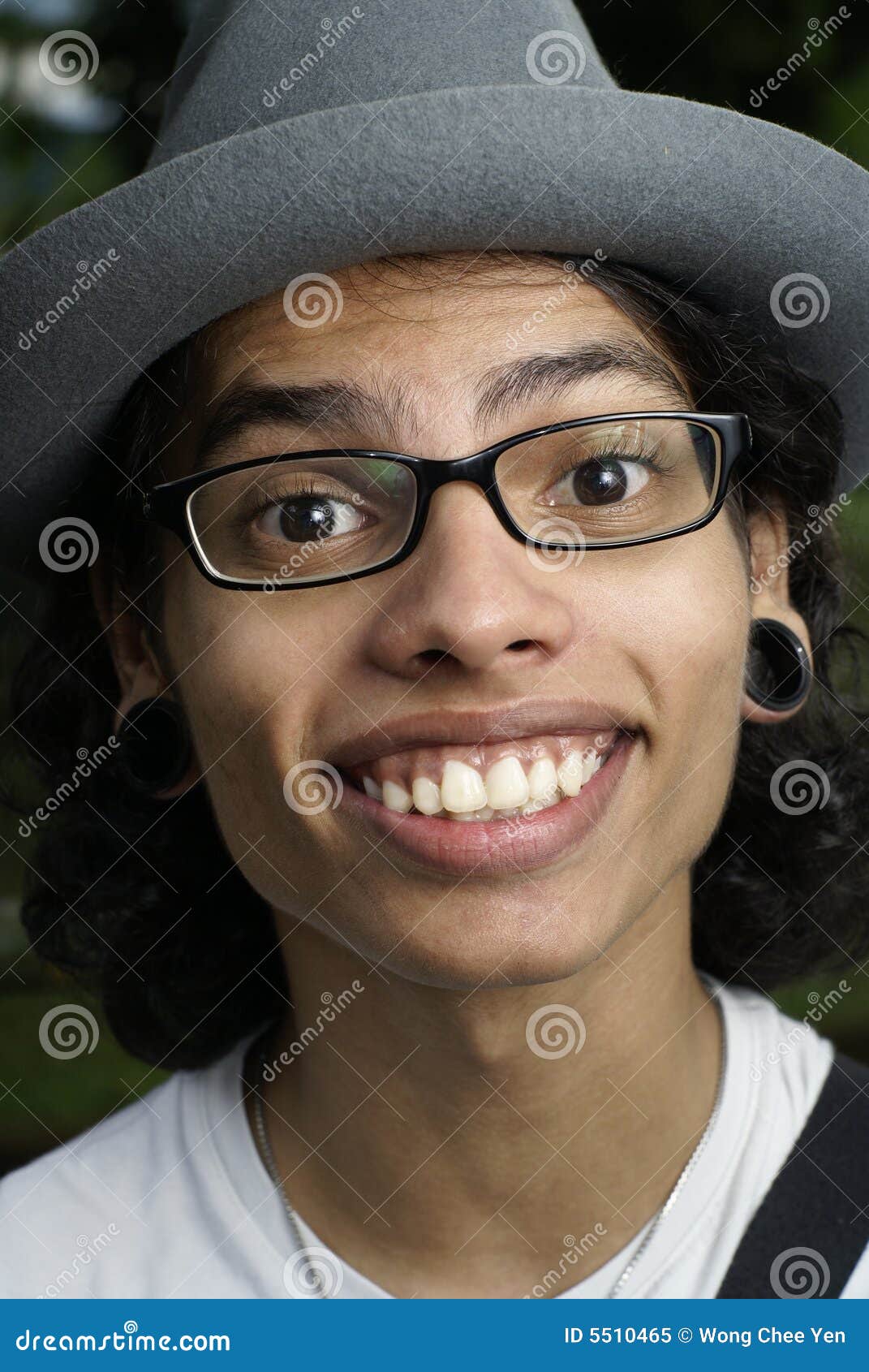 Grinning Asian Man with Hat Stock Image - Image of smile, piercing: 5510465