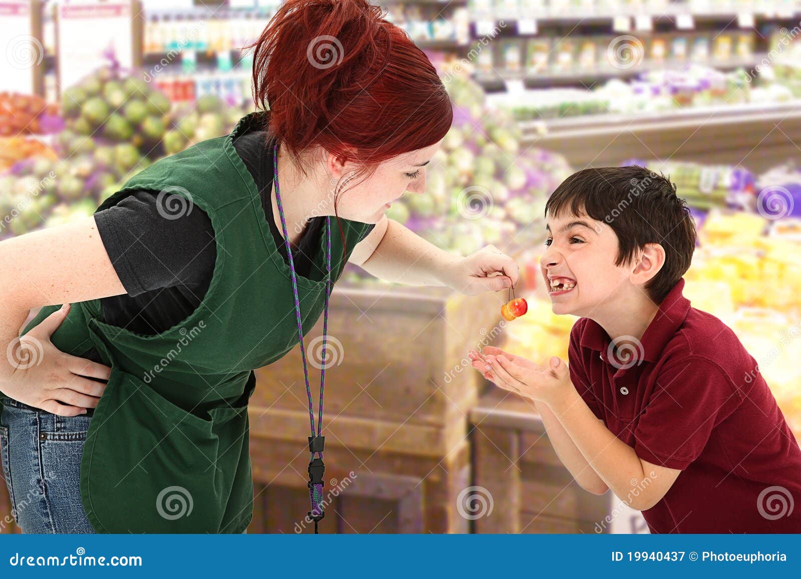 Grocery Clerk Giving Child Cherries In Store Stock Image ...