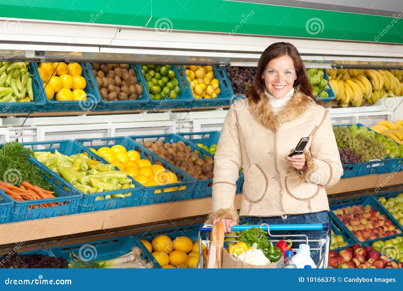 Grocery Store - Smiling Woman with Mobile Phone Stock Image - Image of ...