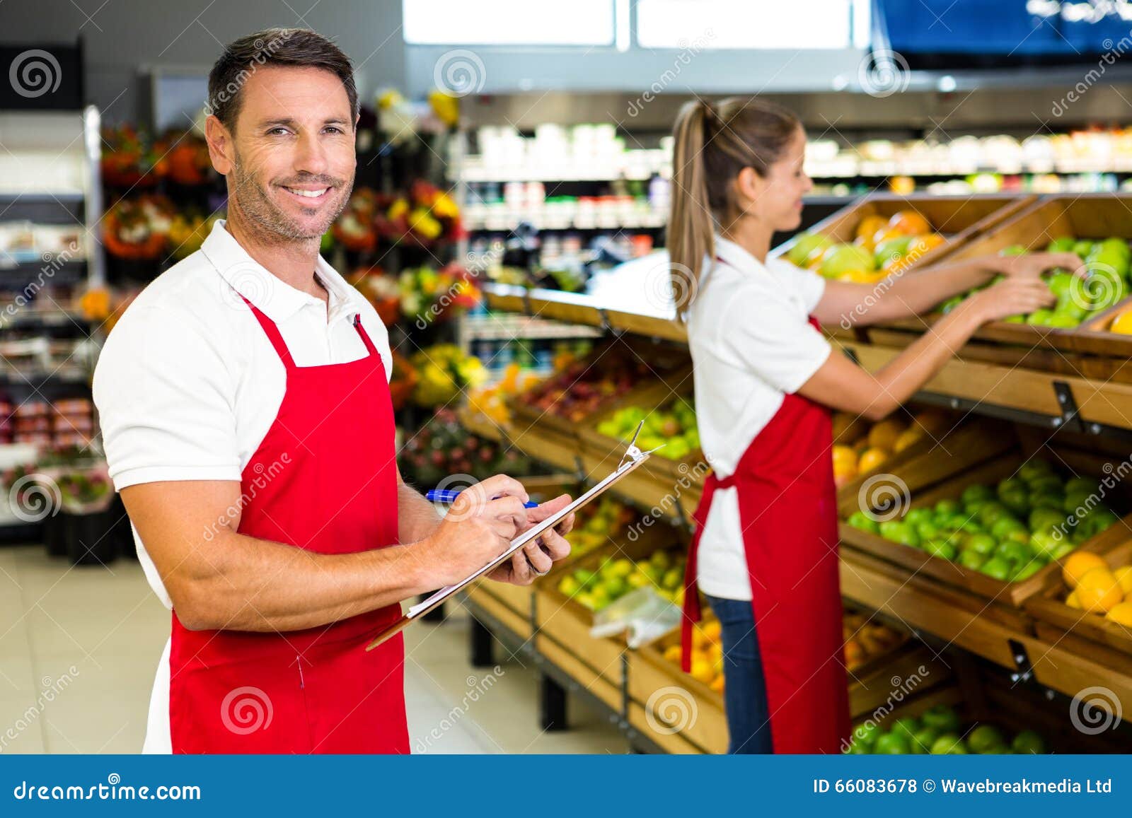 Grocery Store Staff with Clipboard Stock Photo - Image of apron ...