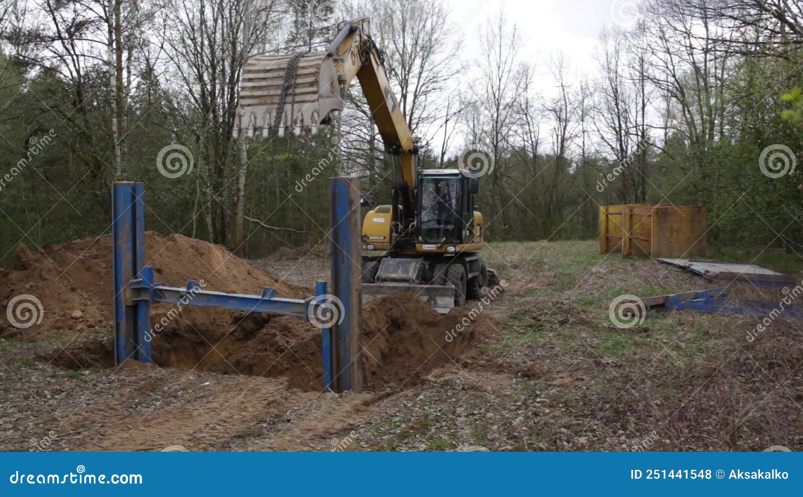The Excavator Operator Installs First Structure Consisting of Two ...