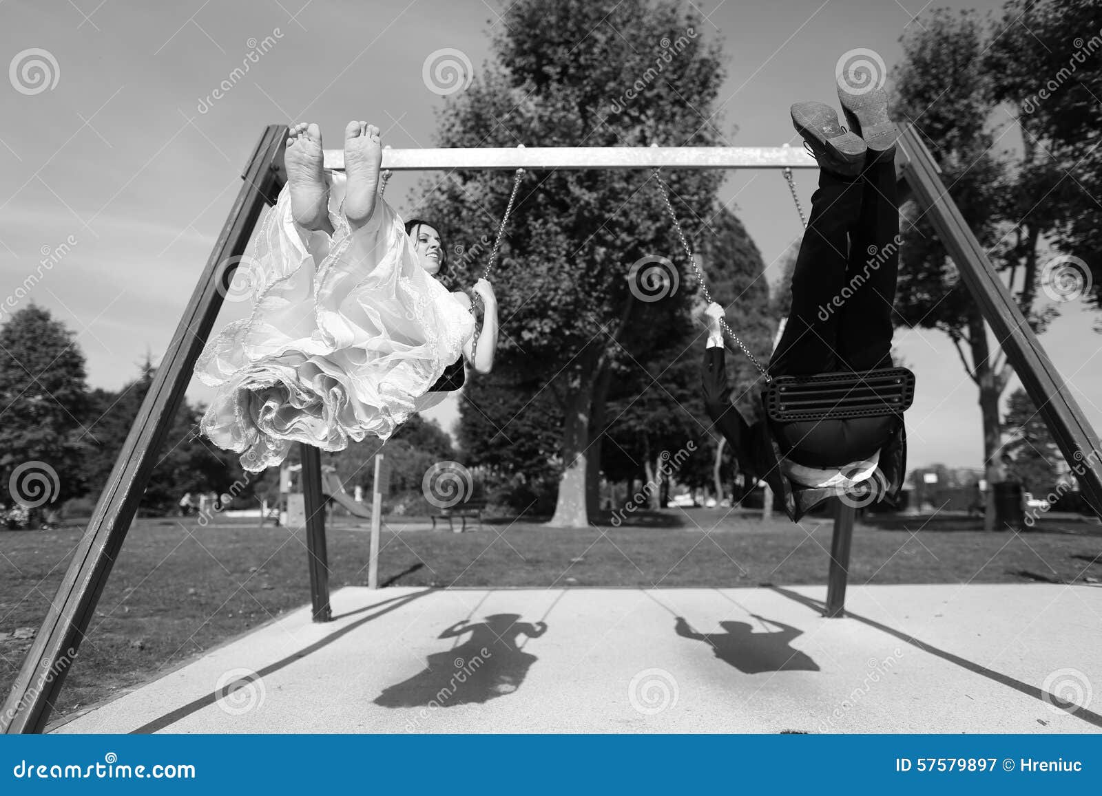 Groom and Bride Having Fun on a Swing Set Stock Image - Image of blonde ...