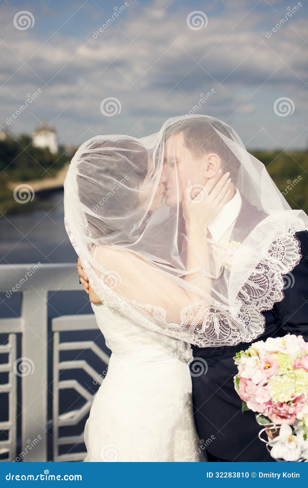 Groom and bride kissing stock photo. Image of modern - 32283810
