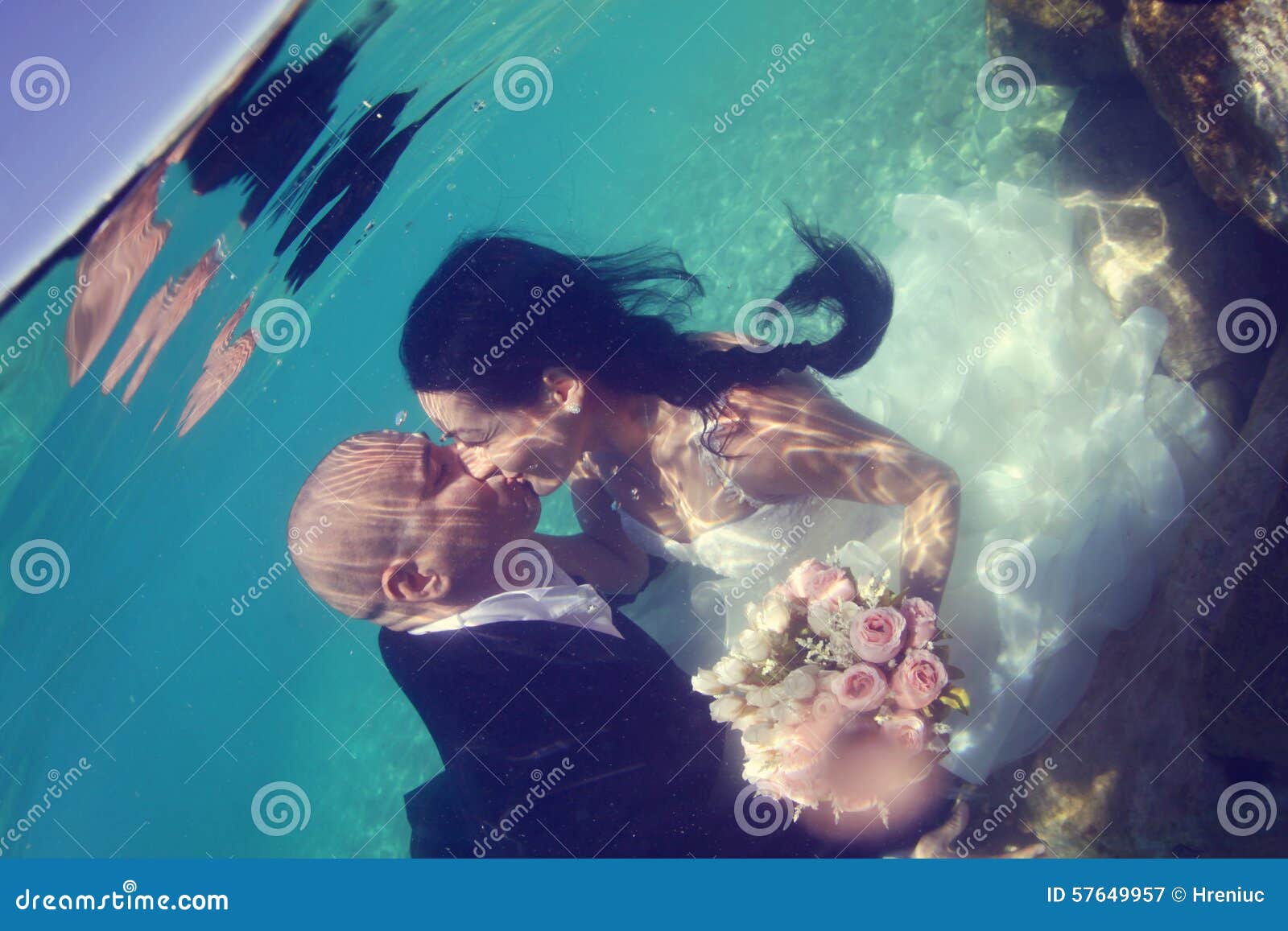 Groom and Bride Kissing Underwater Stock Image - Image of bowtie ...