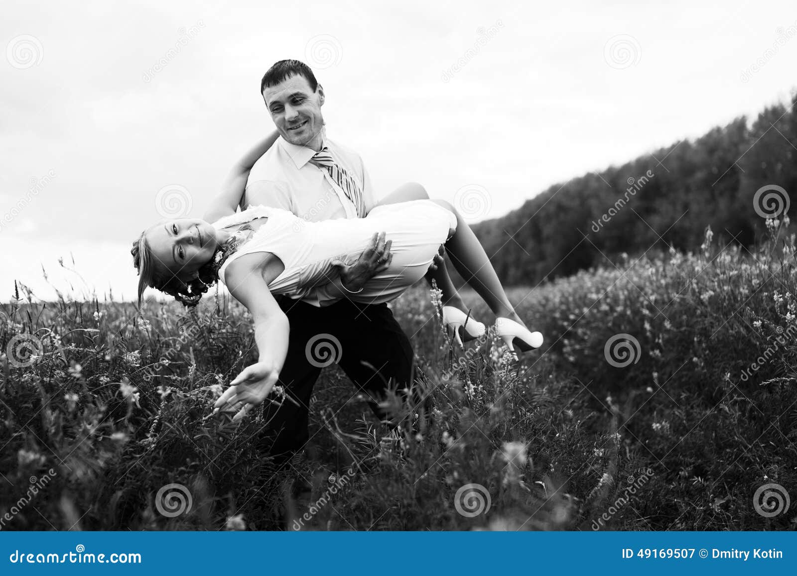 Groom carry a bride stock image. Image of lifestyle, hold - 49169507