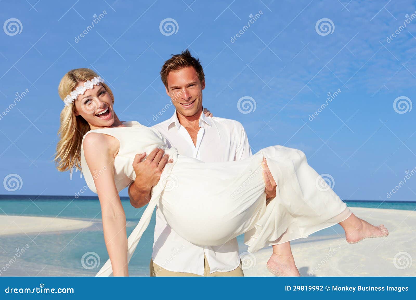 Groom Carrying Bride at Beautiful Beach Wedding Stock Photo - Image of ...