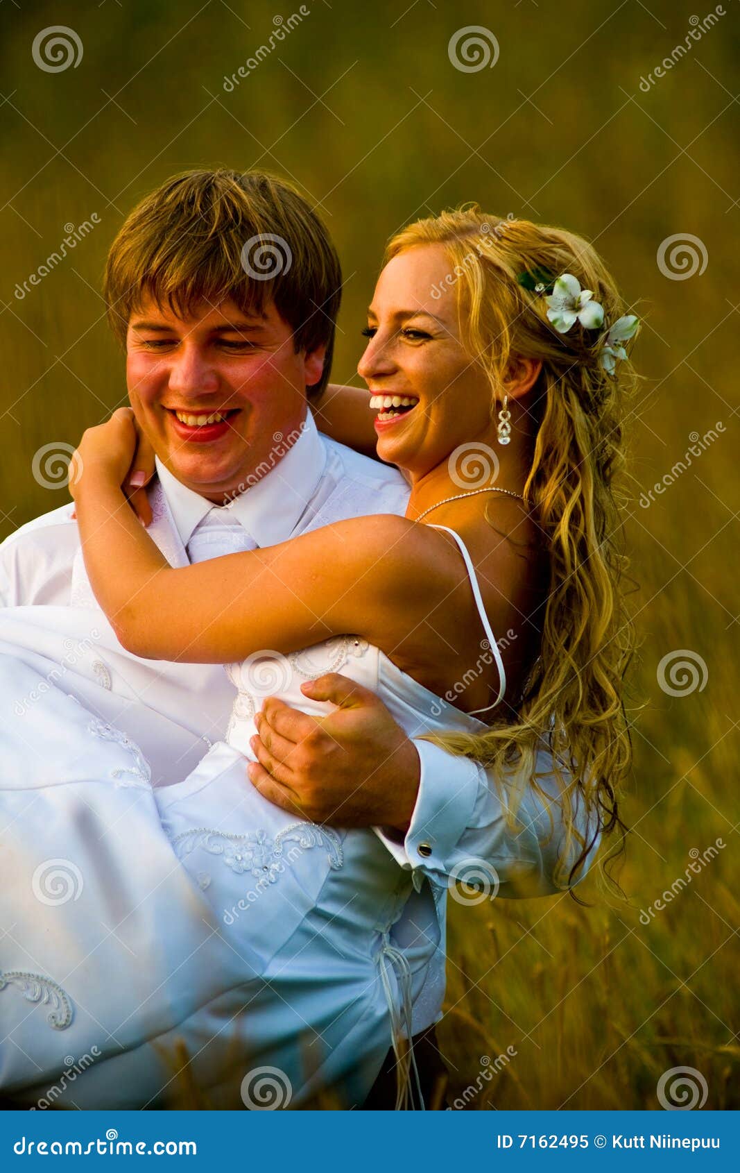 Groom Carrying Bride in Field Stock Image - Image of field, happy: 7162495