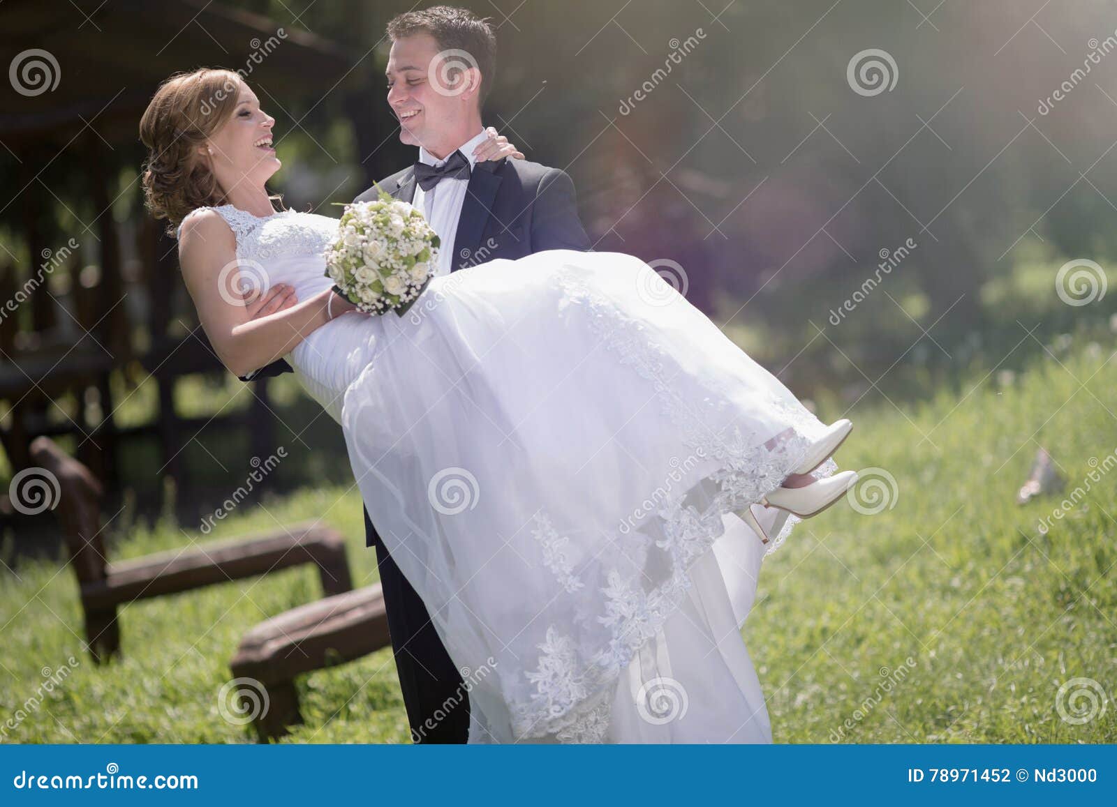 Groom Carrying Bride Outdoors Stock Photo - Image of happiness, married ...