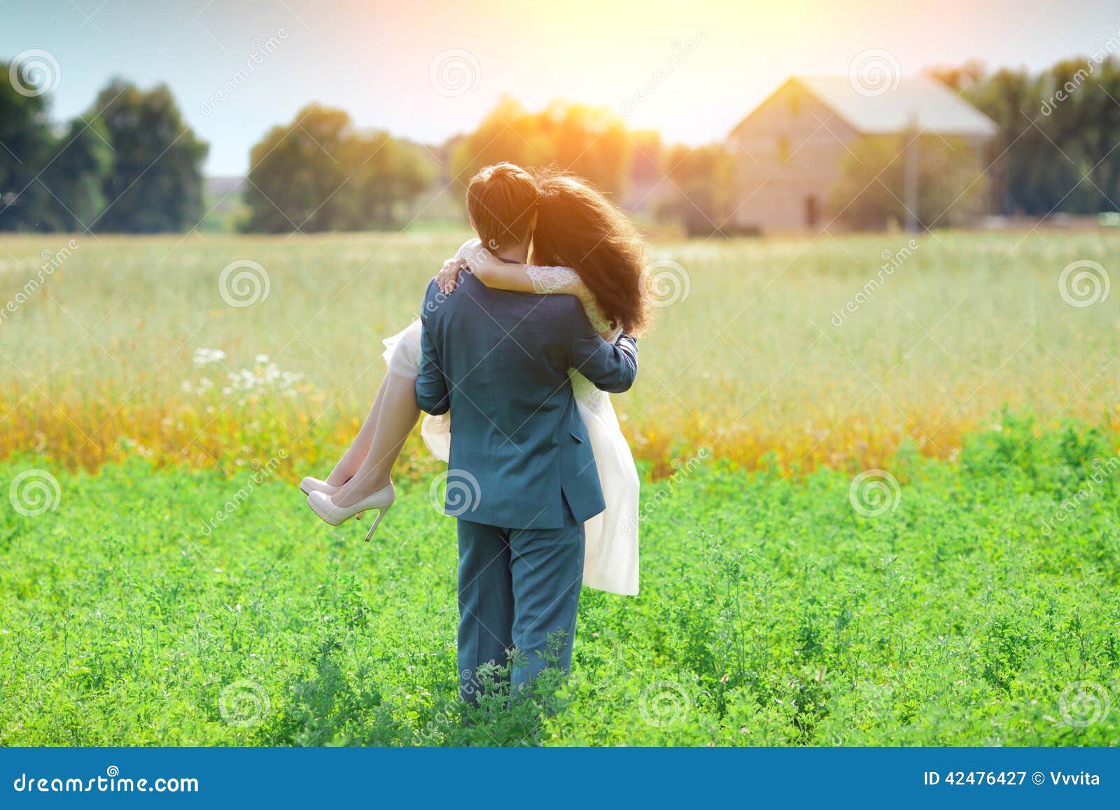 Groom carrying his bride stock image. Image of female - 42476427