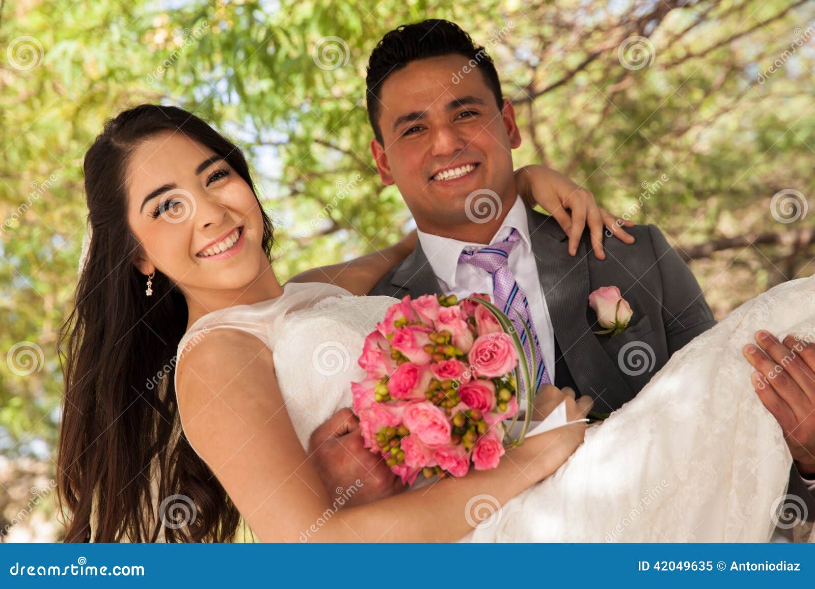 Groom carrying his bride stock image. Image of couple - 42049635