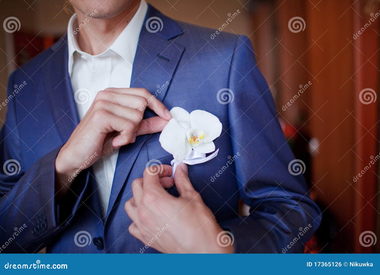 Groom getting flowers stock photo. Image of fashionable - 17365126