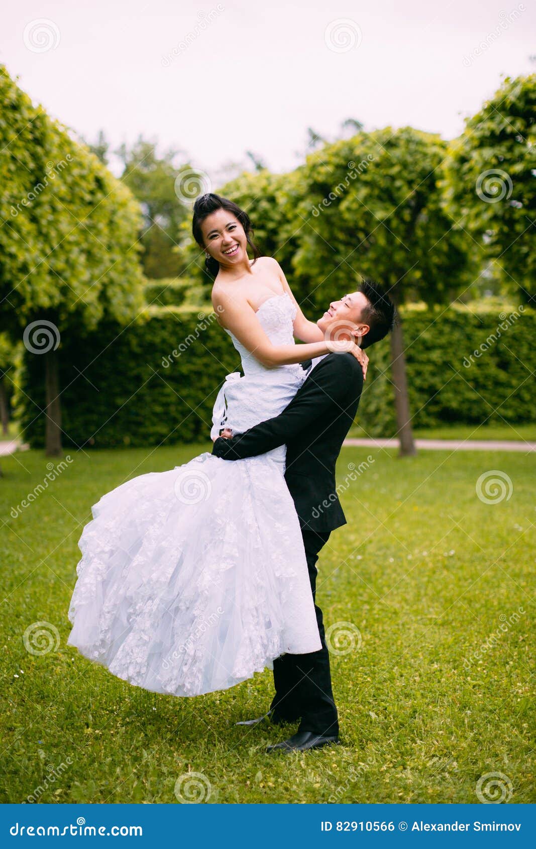 Groom holding bride stock photo. Image of direction, affection - 82910566