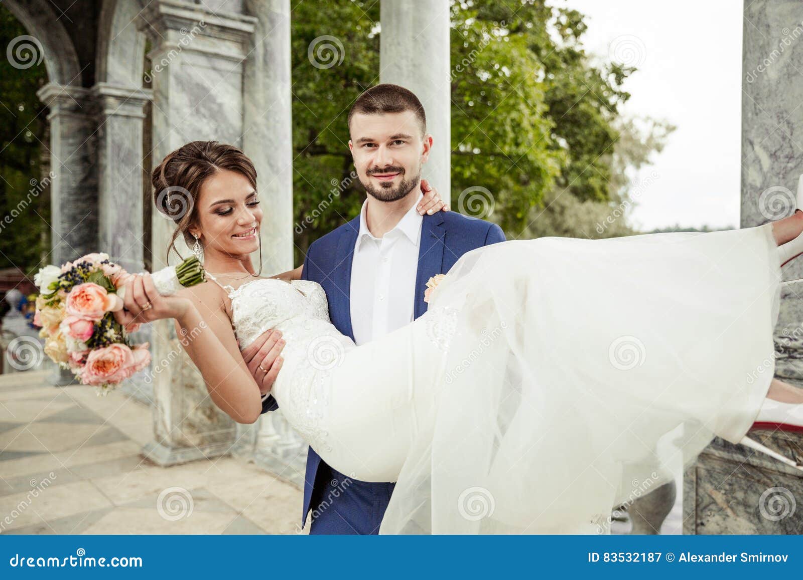 Groom holding a bride stock image. Image of girl, dress - 83532187