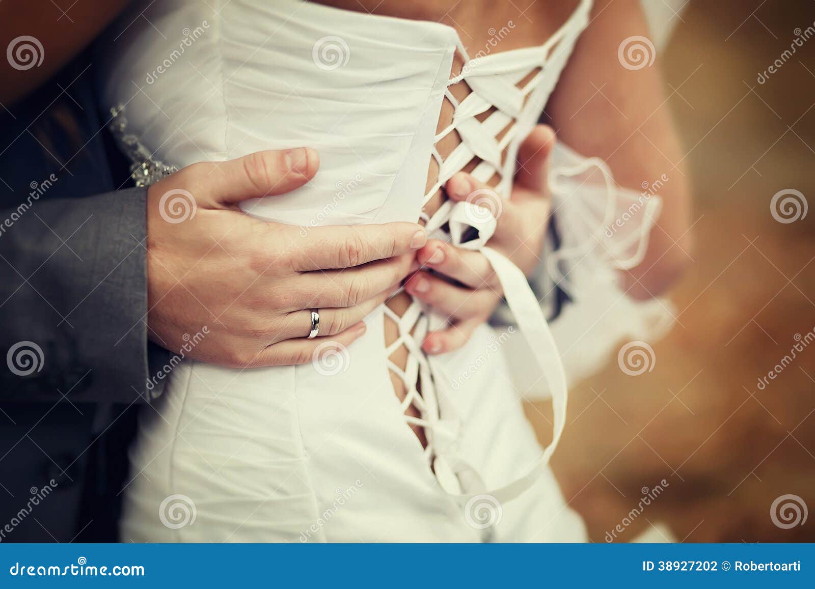 Groom holding the bride stock photo. Image of closeup - 38927202