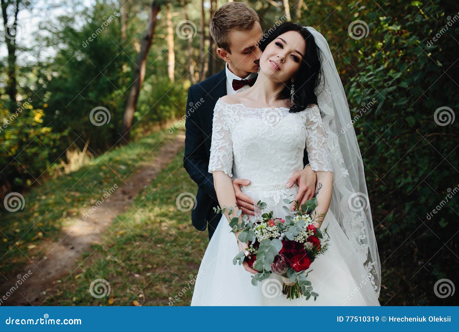 Groom kisses the bride stock image. Image of smiling - 77510319