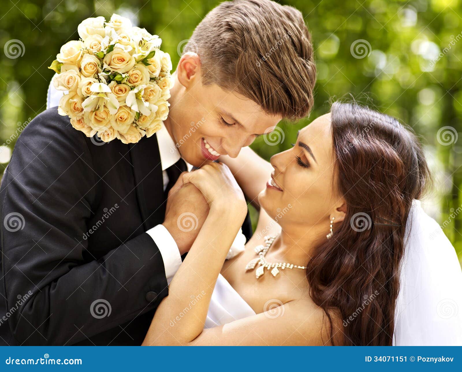 Groom kissing bride. stock image. Image of embrace, male - 34071151