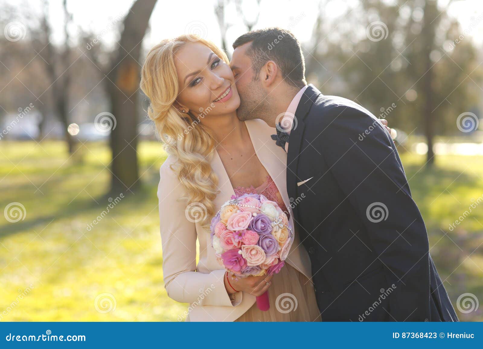 Groom kissing his bride stock image. Image of lace, family - 87368423