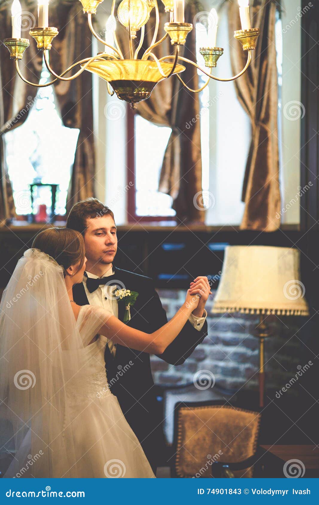 Groom Looks Proud Dancing with Bride in Vintage Hall Stock Image ...