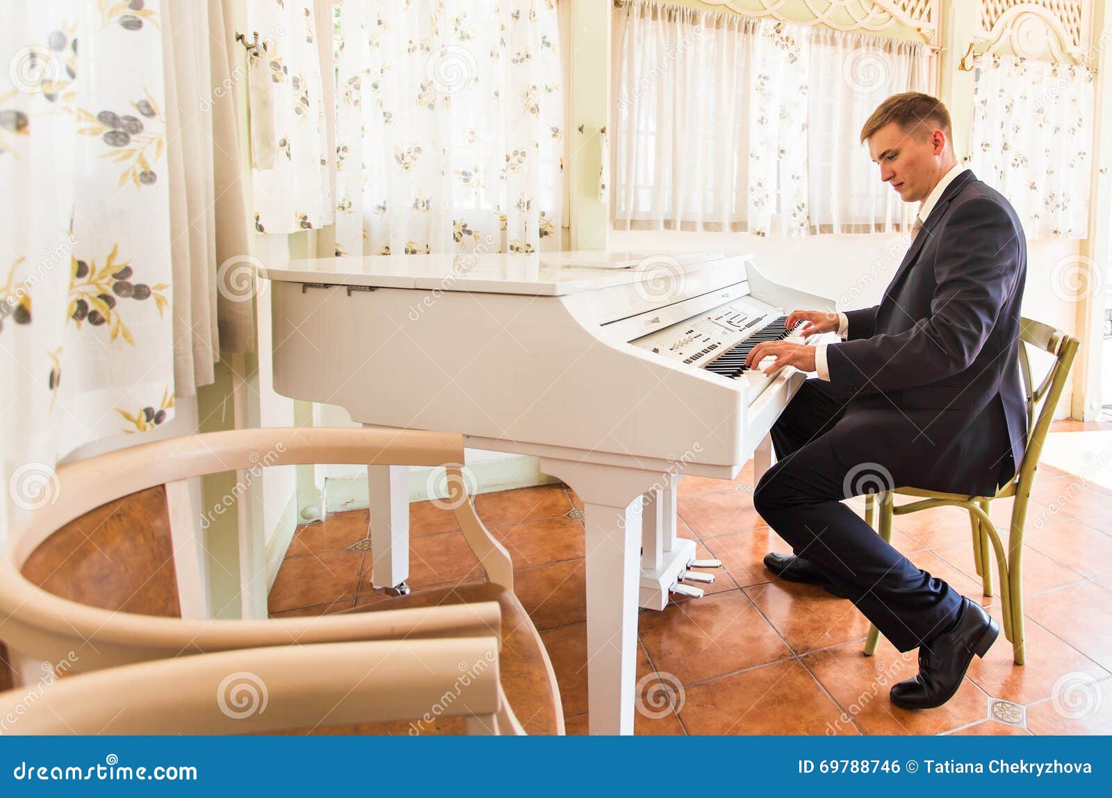 Groom Playing on a Piano in the Room Stock Photo - Image of lady ...