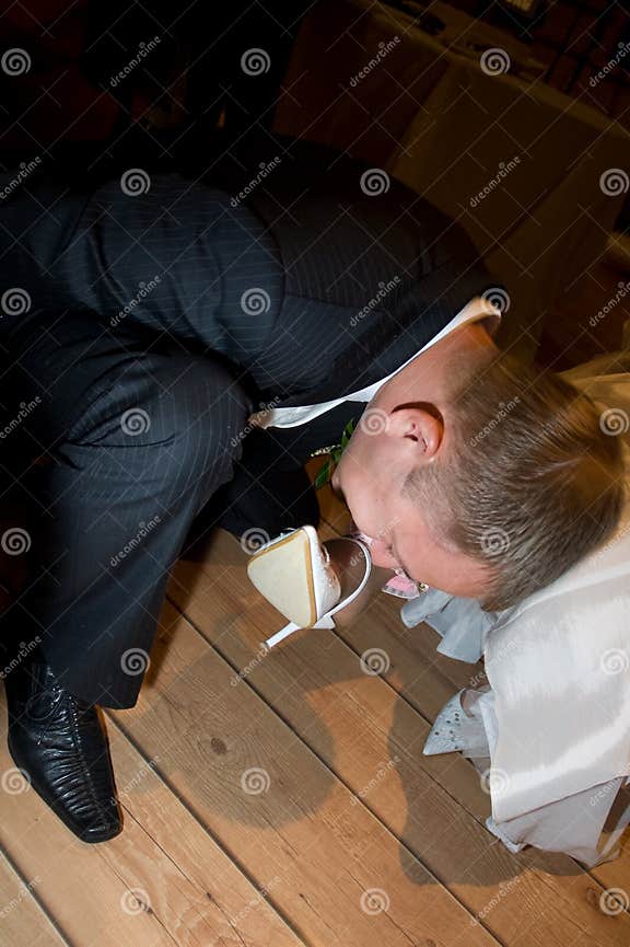 Groom removing garter stock image. Image of traditional - 3450187