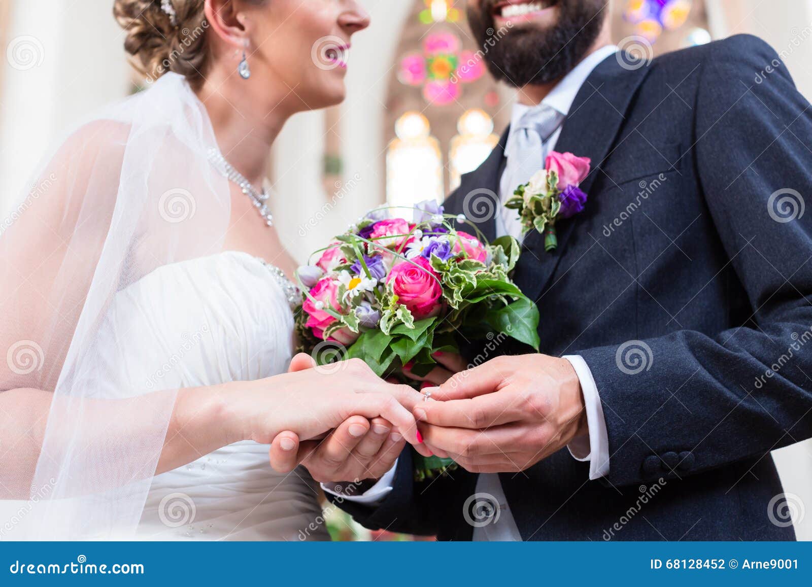 Groom Slipping Ring on Finger of Bride at Wedding Stock Photo - Image ...