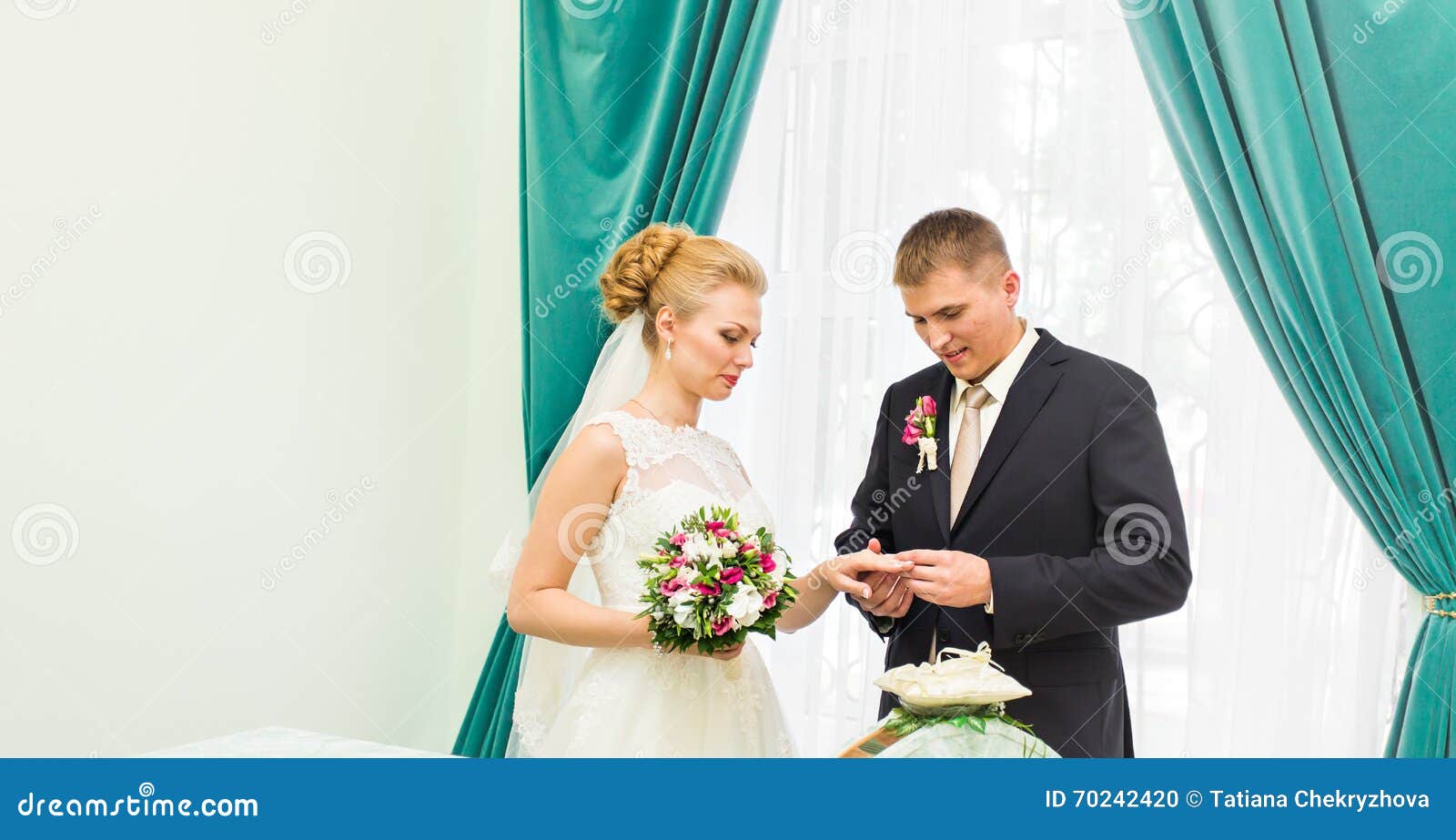 Groom Slipping Ring on Finger of Bride at Wedding Stock Photo - Image ...