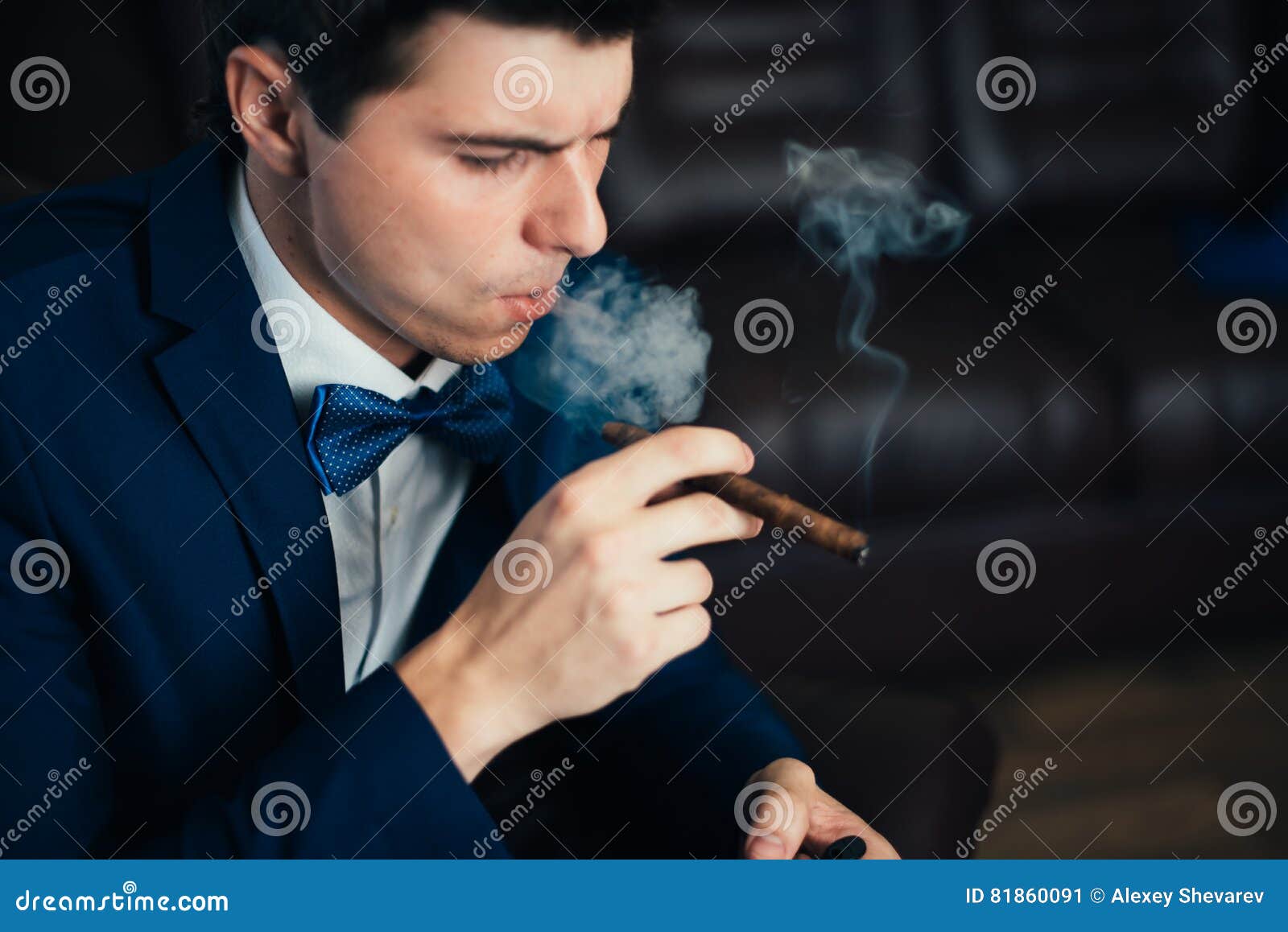 The Groom in a Suit Smoking Cigar Stock Image - Image of gray ...