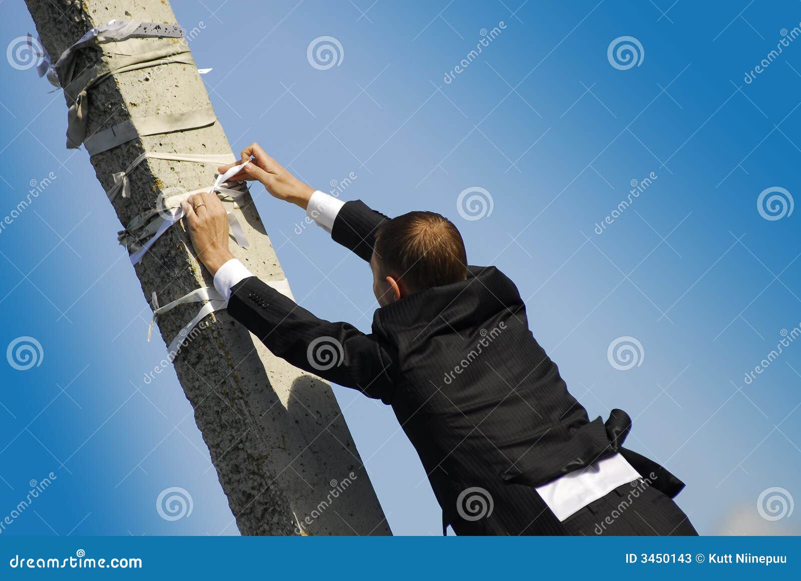 Groom tying tape to post stock image. Image of ritual - 3450143