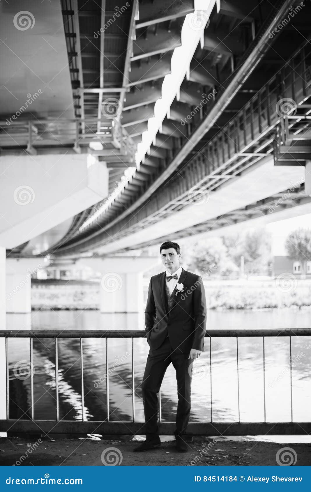Groom under the bridge stock photo. Image of husband - 84514184