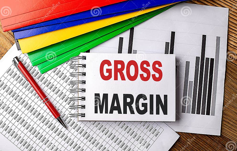 GROSS MARGIN Text on a Notebook with Pen, Folder on a Chart Background ...