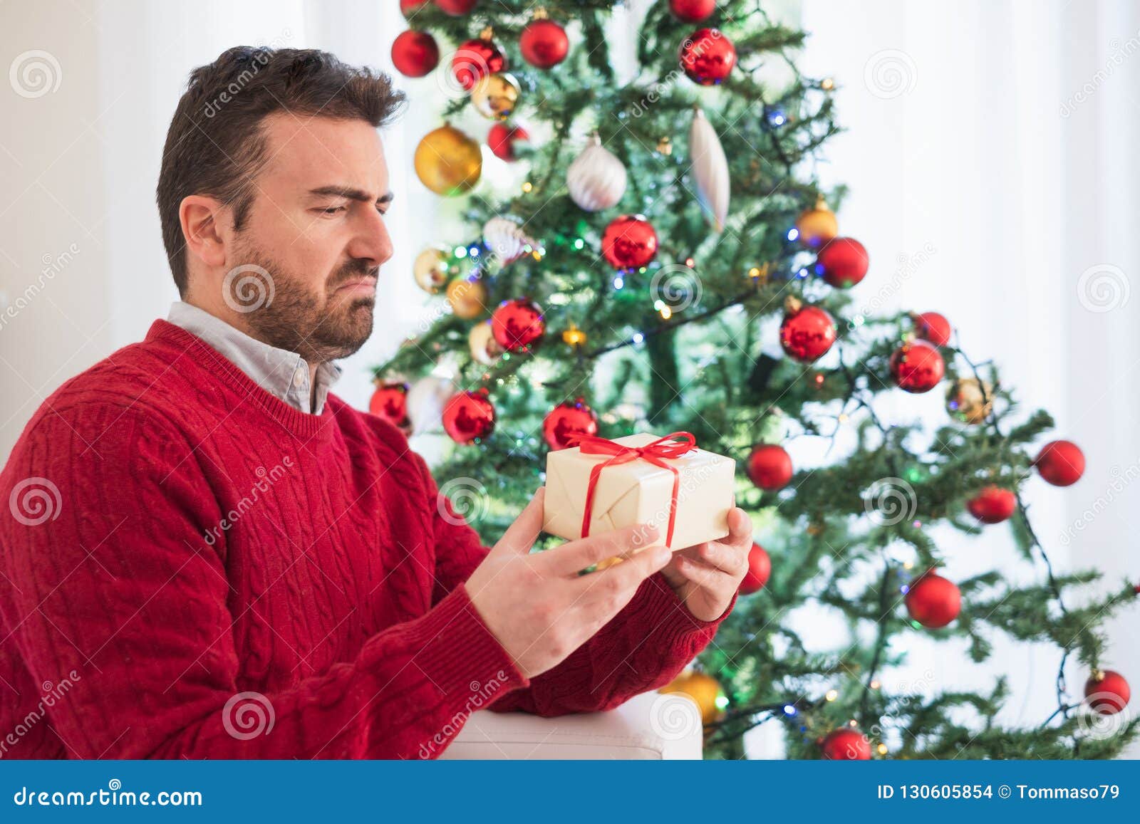 Grossed Out Man by Wrong Gift for Christmas Stock Photo - Image of hand ...