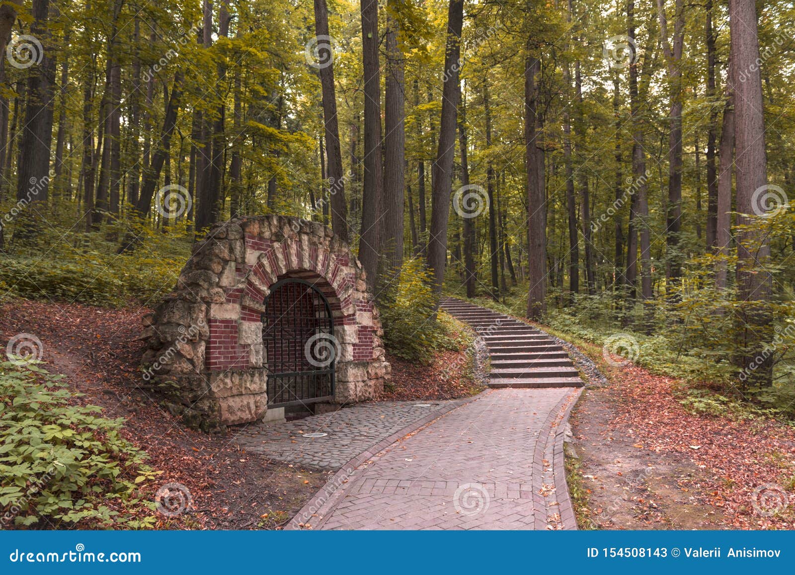 Grotto in the Park of a Closed Grille. Forest Path Stock Image - Image ...