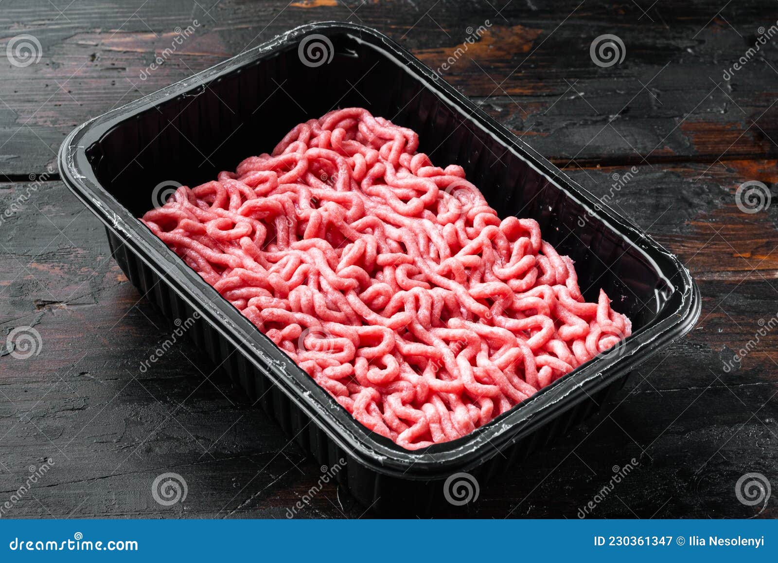 Ground Beef Meat in Plastic Tray, on Old Dark Wooden Table Background ...