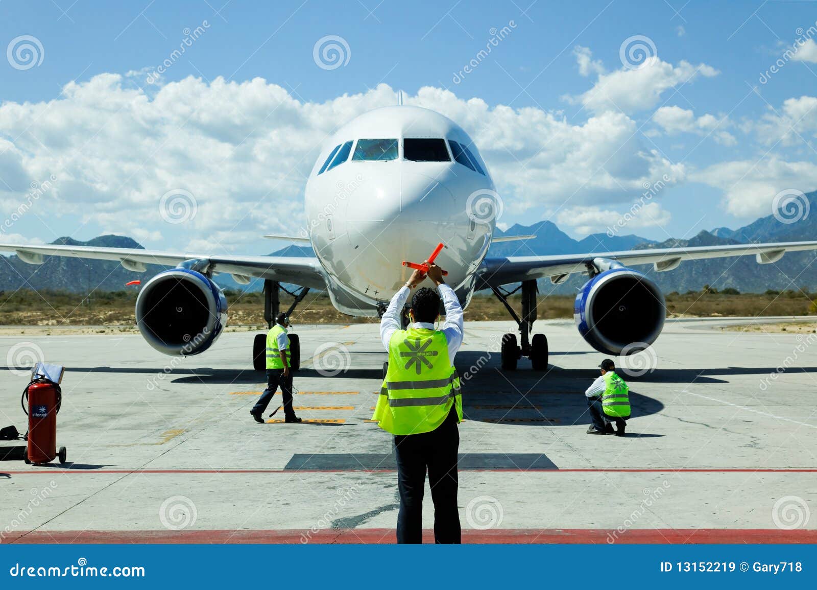 Ground Crew Guides a Jet To the Gate Editorial Stock Image - Image of ...